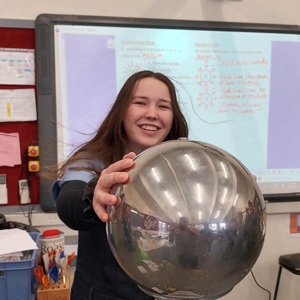 Hair raising experiments in Physics. Anna Roberts demonstrated the ...