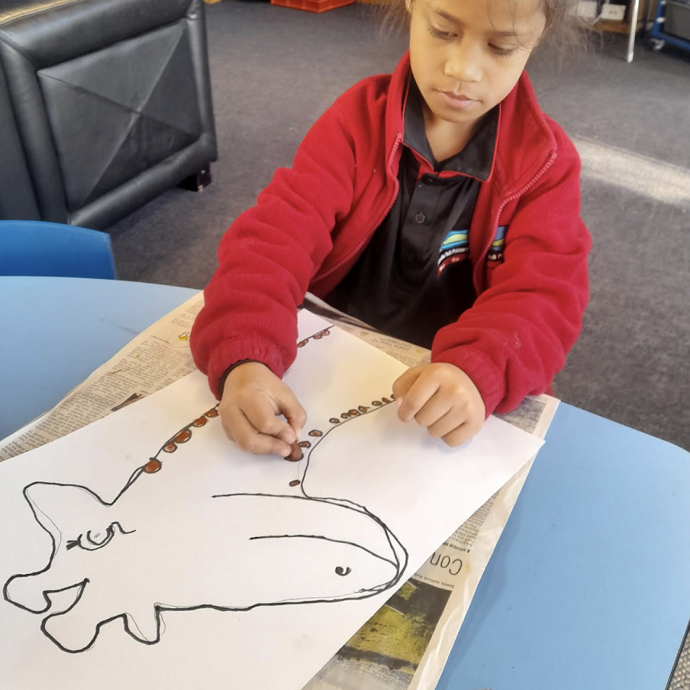 Tūī creating our Harold artwork master piece!