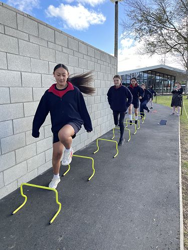 Students from Puneke 15 carry out their fitness routines with sporting ...