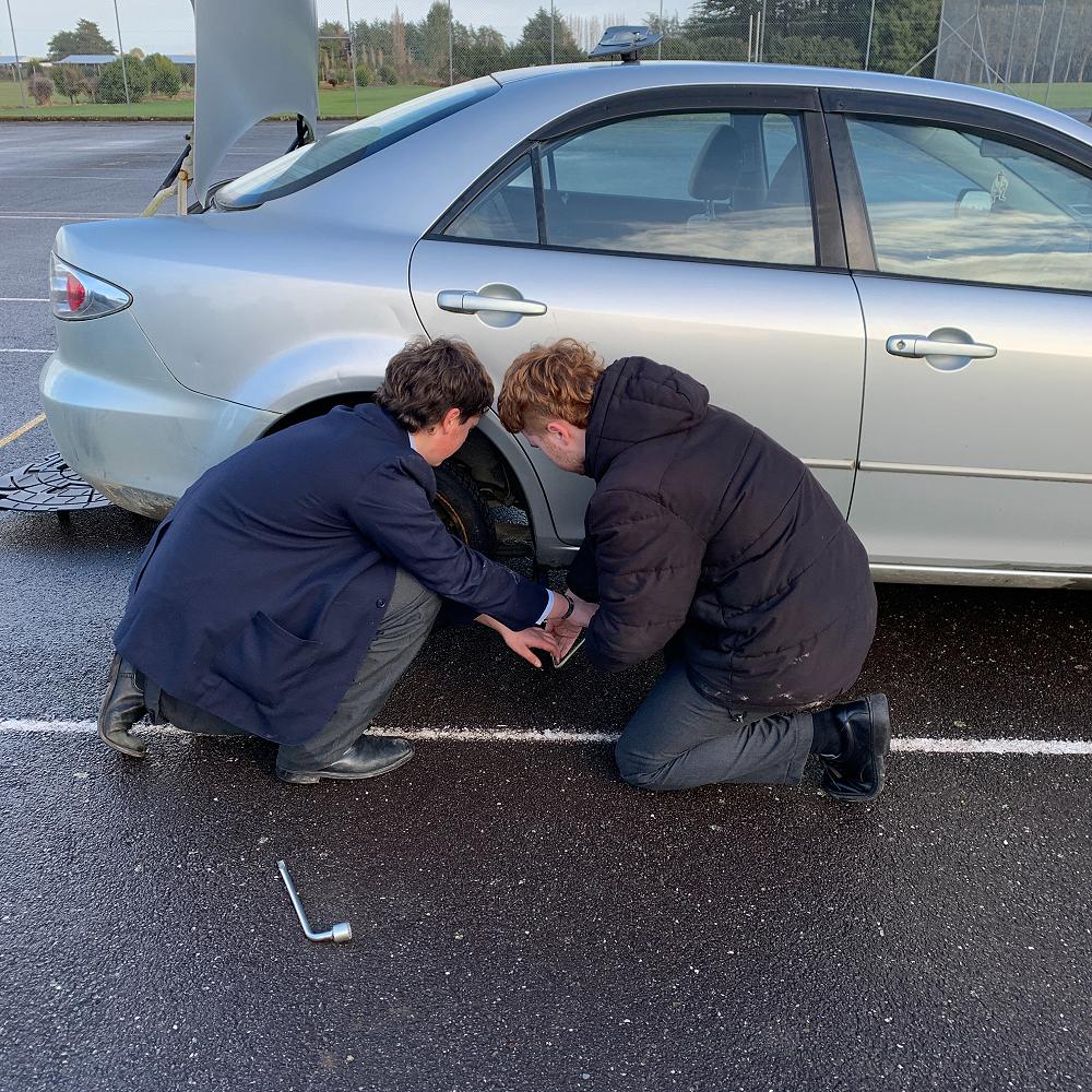 Year 11 and 12 Futures students learning essential car maintenance skills.